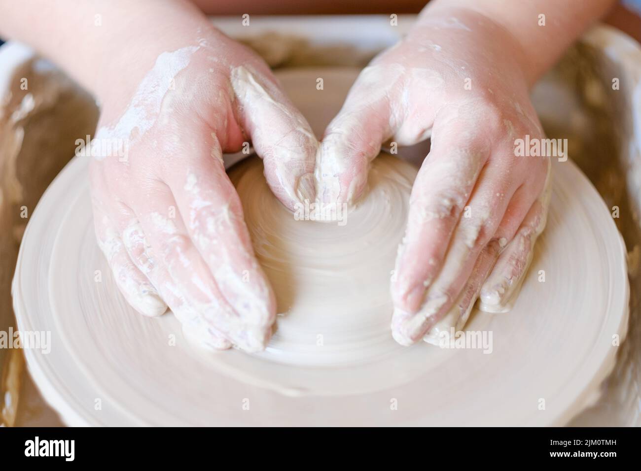 Pottery wheel hands hi-res stock photography and images - Alamy