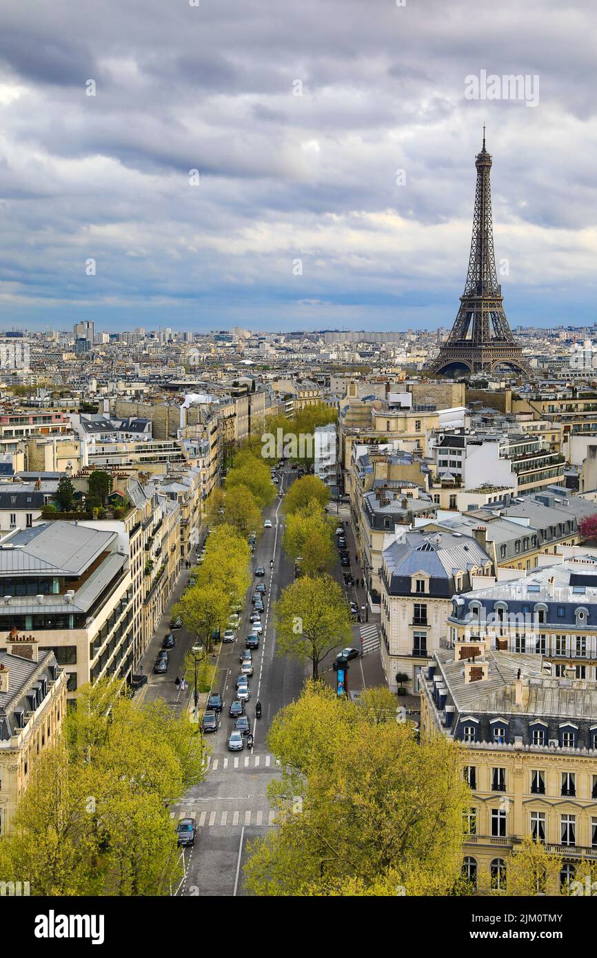 A vertical cityscape of Paris, France with Eiffel tower against a ...