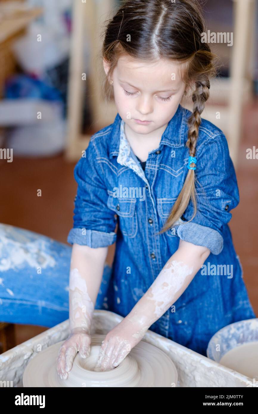 pottery handcraft hobby girl shape clay wheel Stock Photo - Alamy