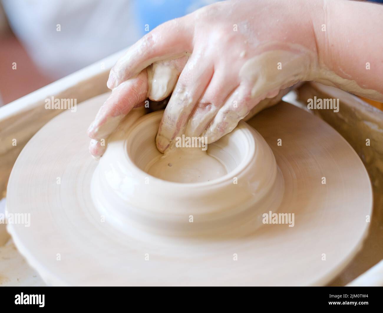 pottery handcraft hobby hands shape clay wheel Stock Photo - Alamy