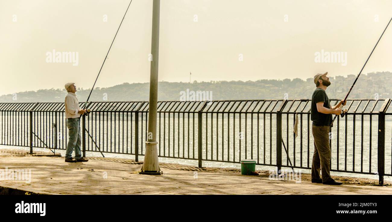 Two fishermen fishing on sea hi-res stock photography and images - Alamy