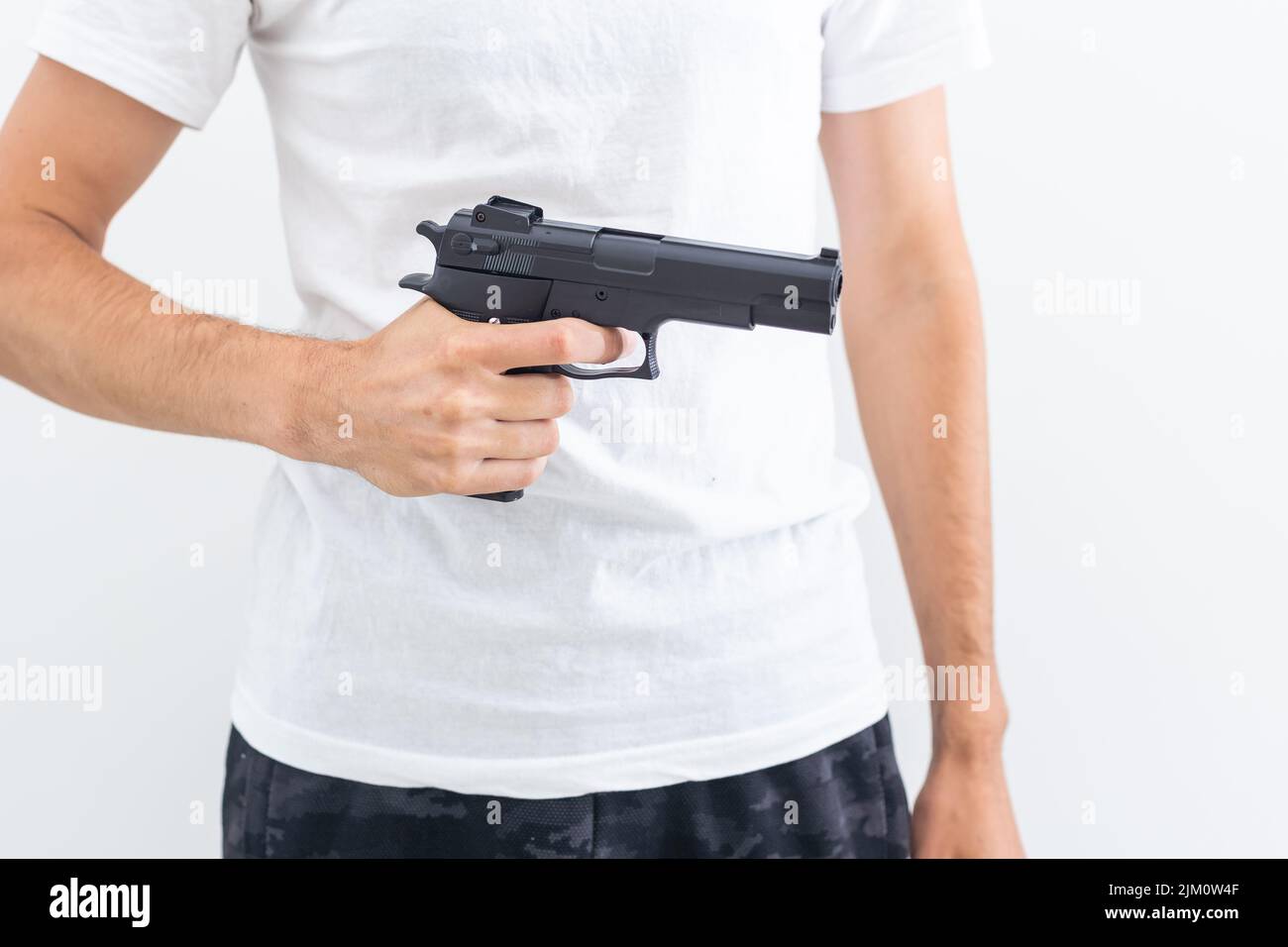 Rear view man holding gun hi-res stock photography and images - Alamy