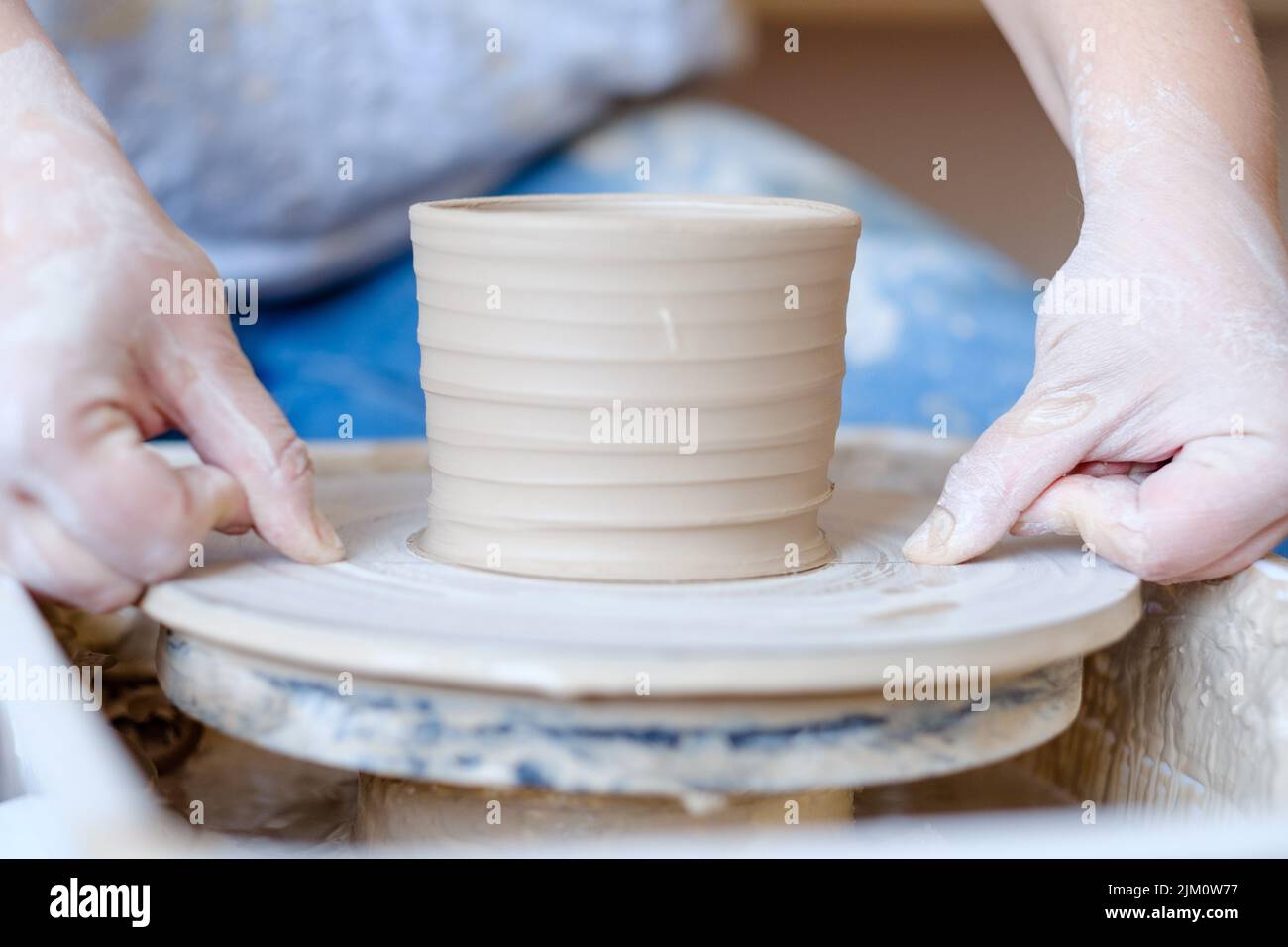 pottery handcraft hobby hands shape clay wheel Stock Photo - Alamy