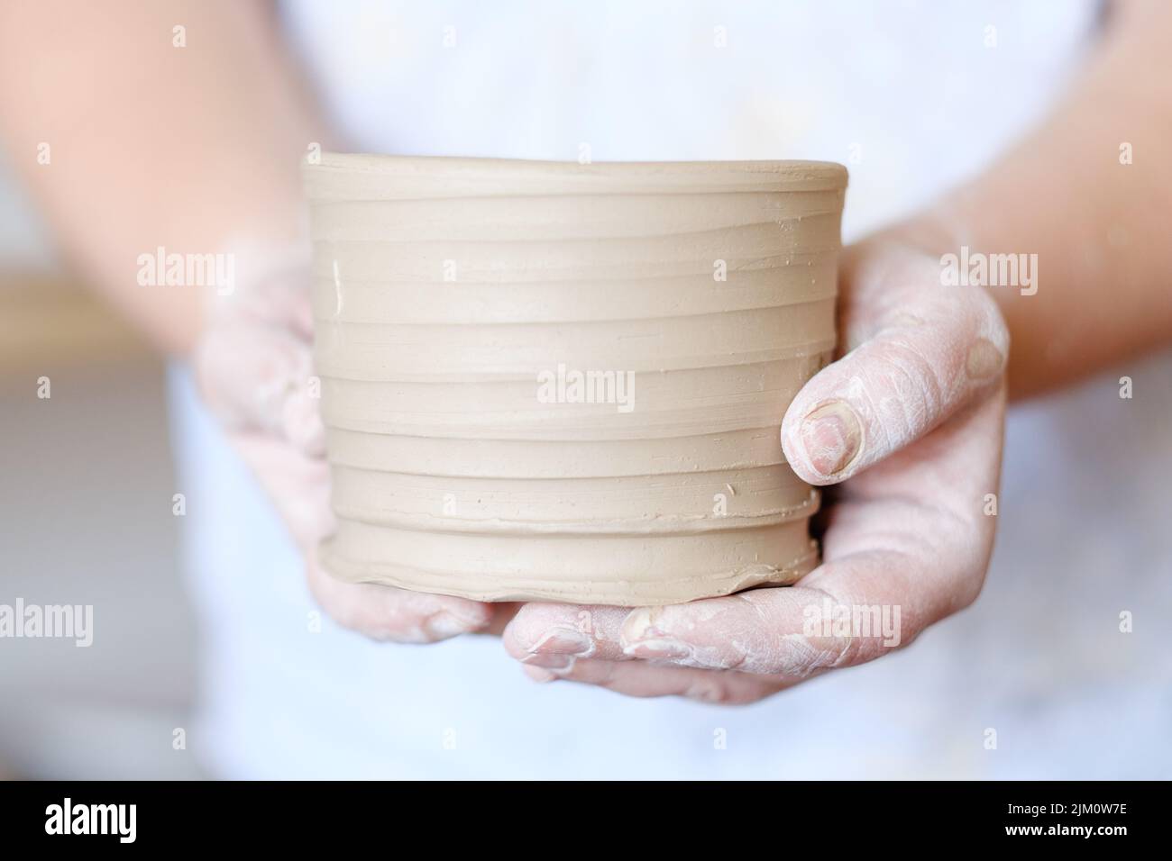 pottery handcraft hobby hands shape clay wheel Stock Photo - Alamy