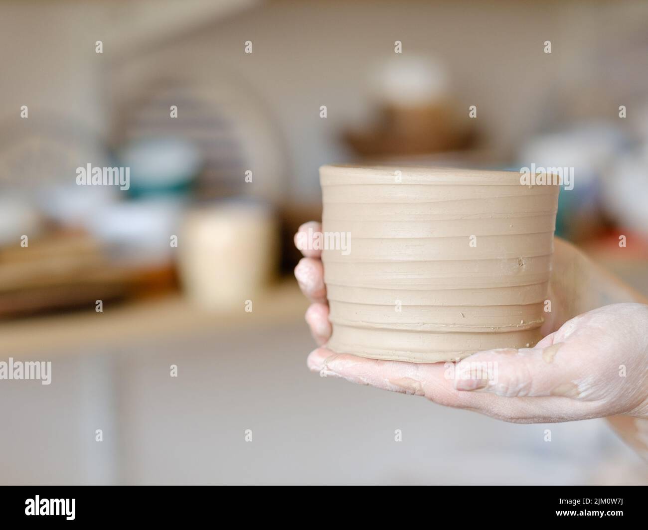 pottery handcraft hobby hands shape clay wheel Stock Photo - Alamy