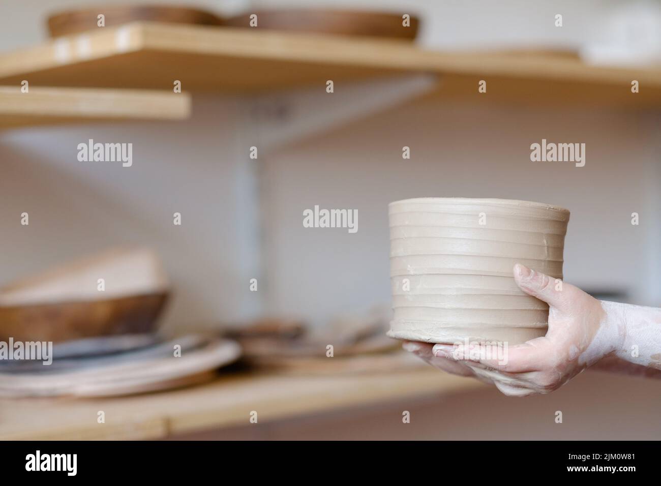 pottery skill traditional hold clay jug crockery Stock Photo - Alamy