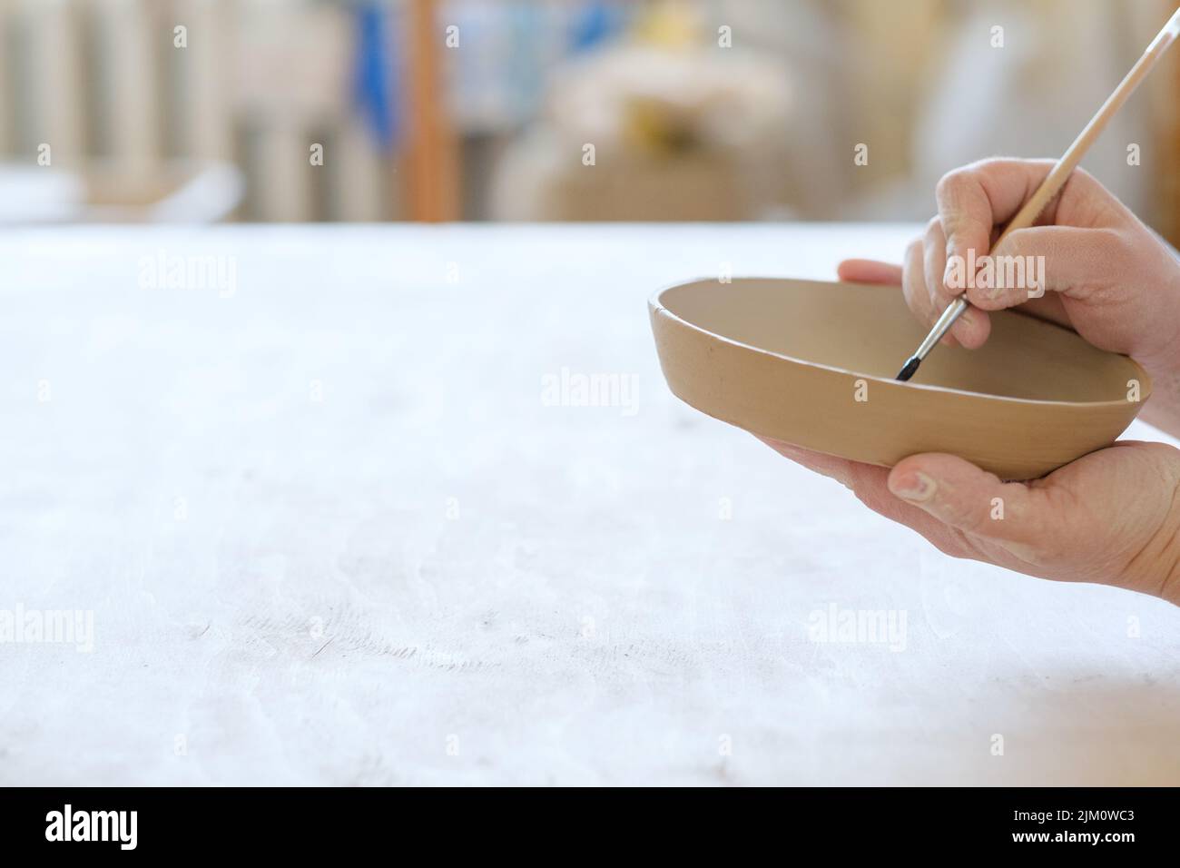 pottery handcraft hobby paint handmade clay plate Stock Photo - Alamy