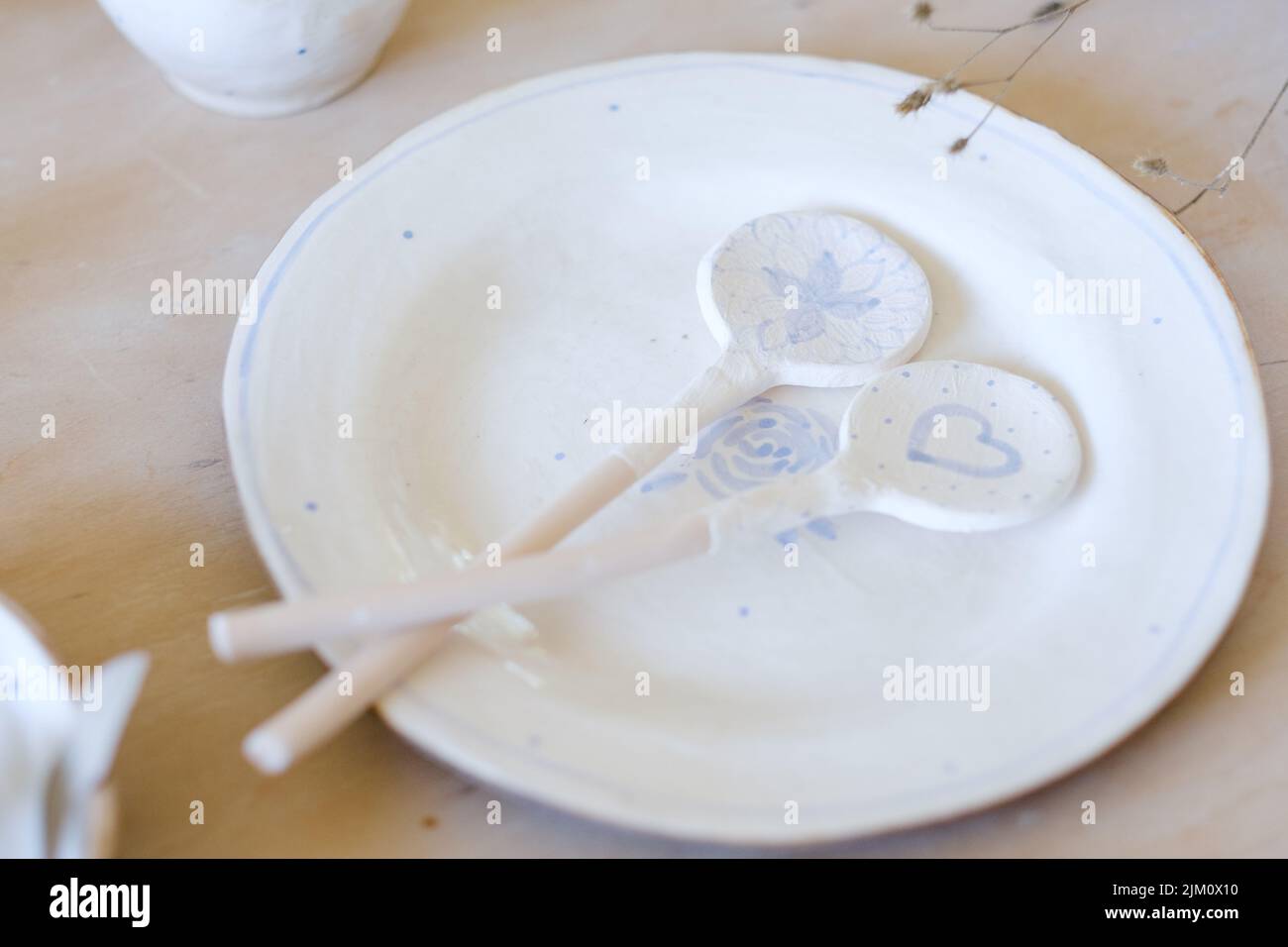 pottery handcraft hobby craft clay plate spoon Stock Photo - Alamy