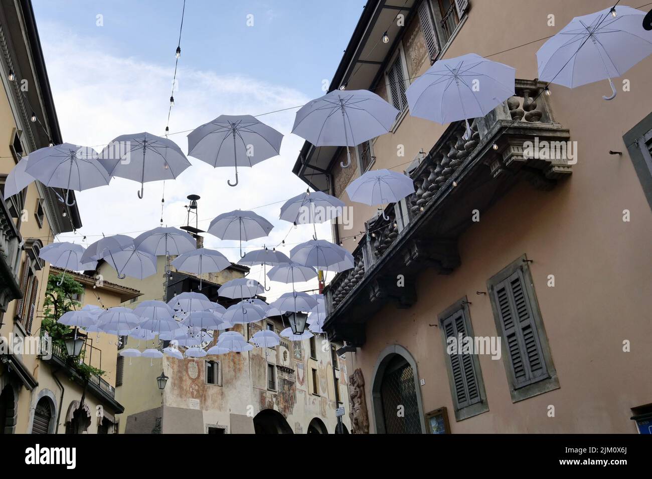 Colorated umbrellas installed in between the streets in Clusone ...