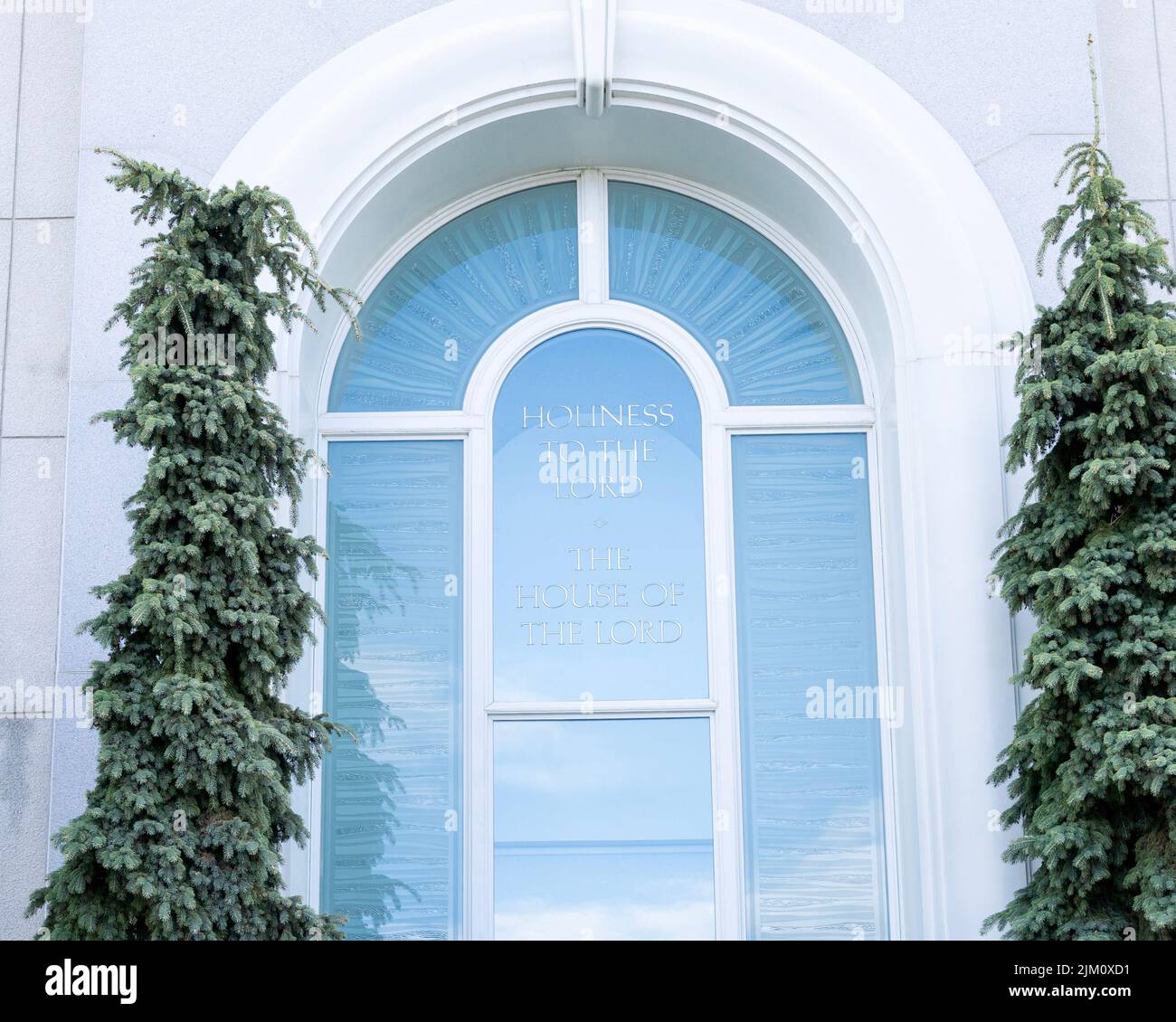 A view of a Mount Timpanogos Utah Temple window with plants Stock Photo ...