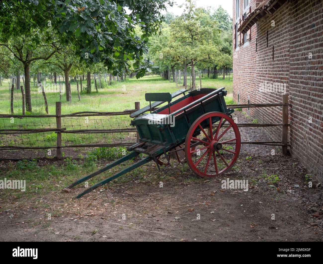 Green antique handcart with red wheels from the 1880s to the 1930s ...