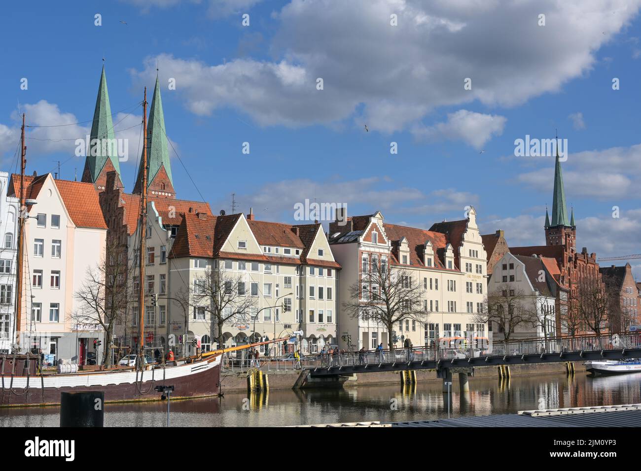 Lubeck, Germany, April 11, 2022: Old town of Lubeck on the river Trave ...
