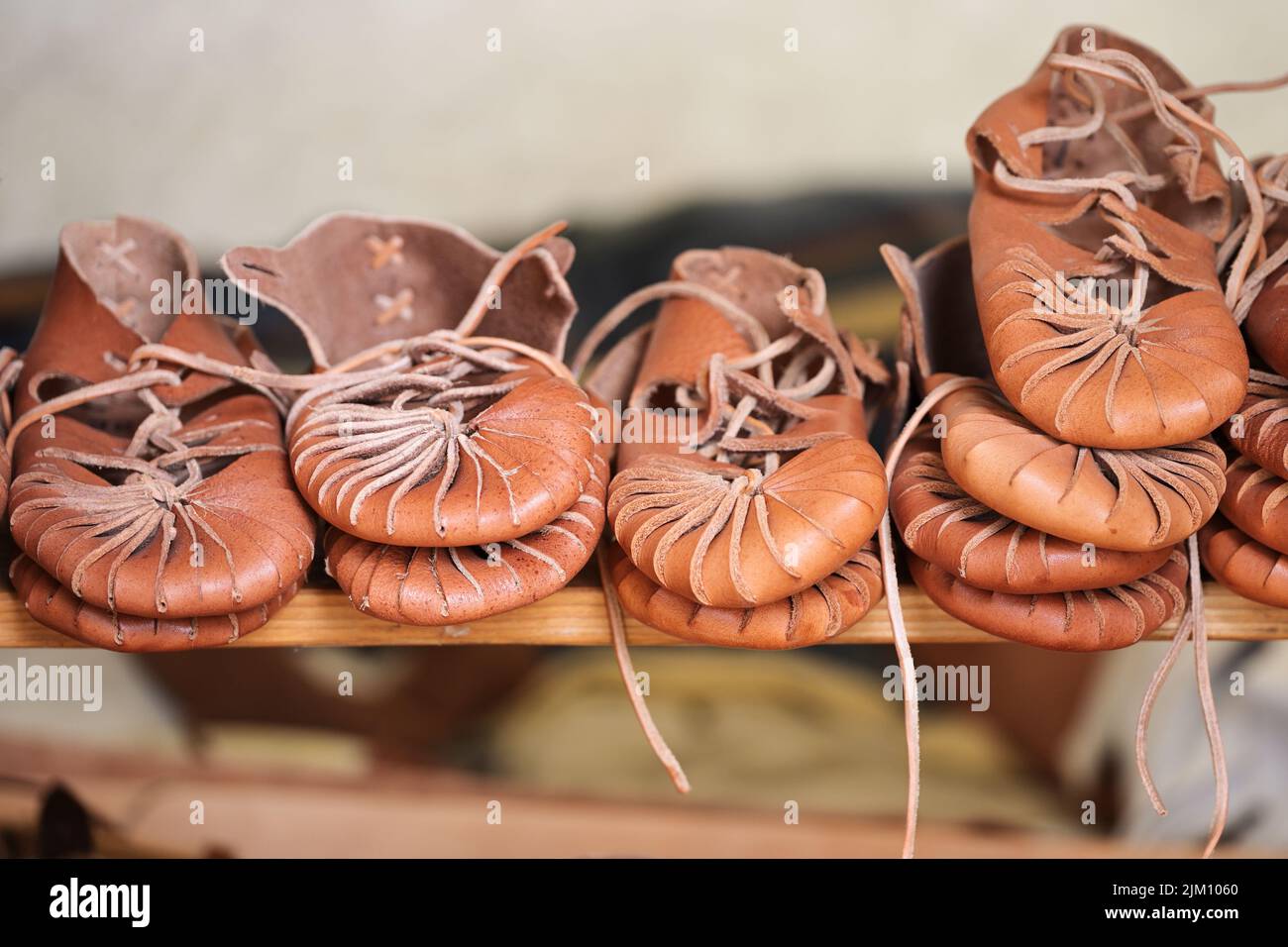 Handmade leather shoes for sale at a medieval market based on the ...