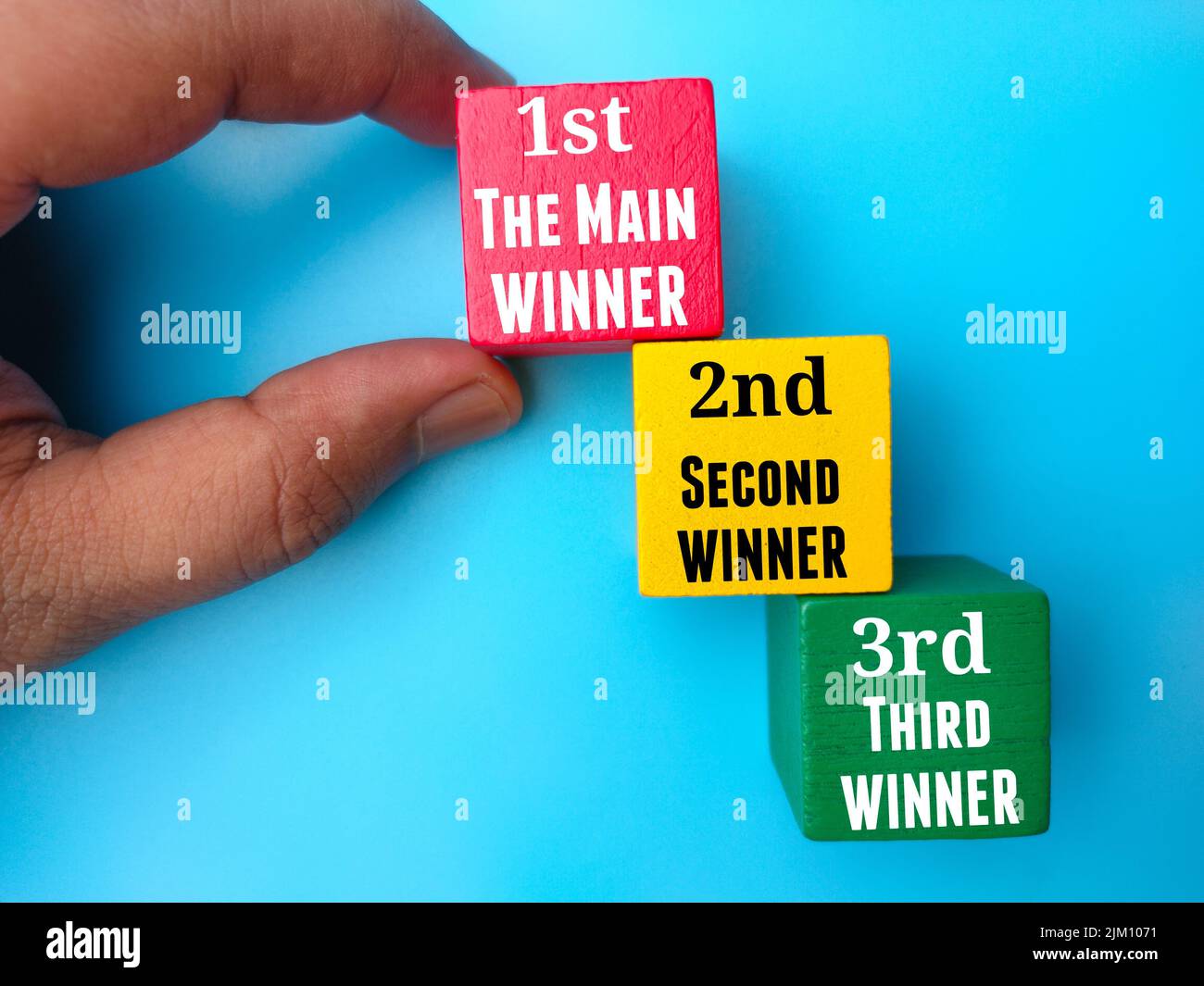 Hand holding winner trophy cup hi-res stock photography and images - Alamy