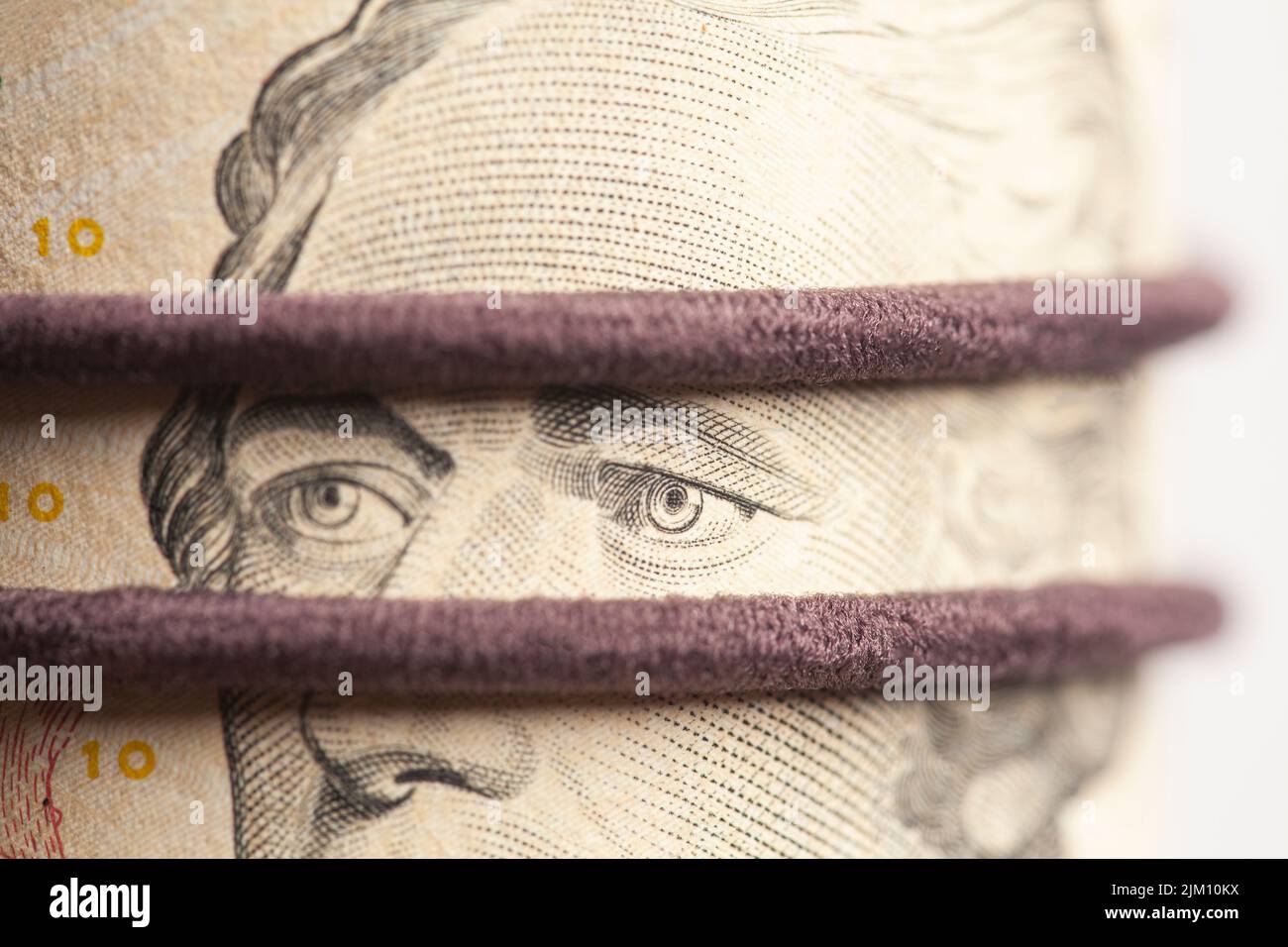 Portrait of Alexander Hamilton in Roll of Ten Dollar Bills Stock Photo ...