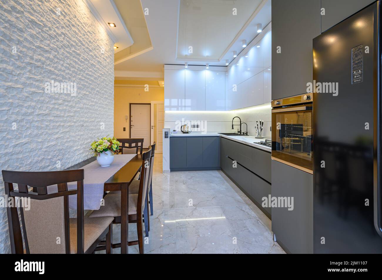 Luxury white and dark grey modern kitchen interior Stock Photo - Alamy