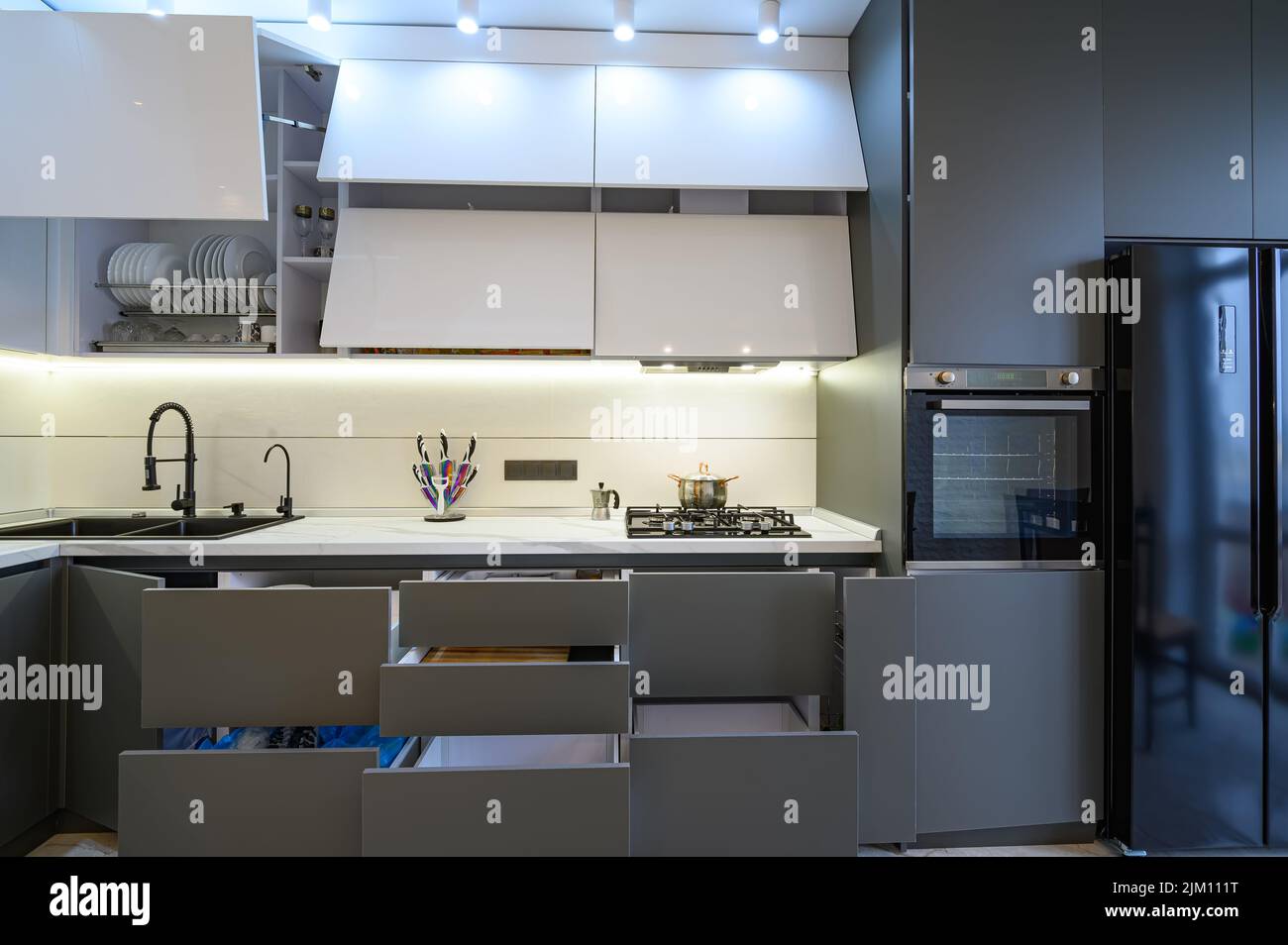 Luxury white and dark grey modern kitchen interior, front view Stock ...