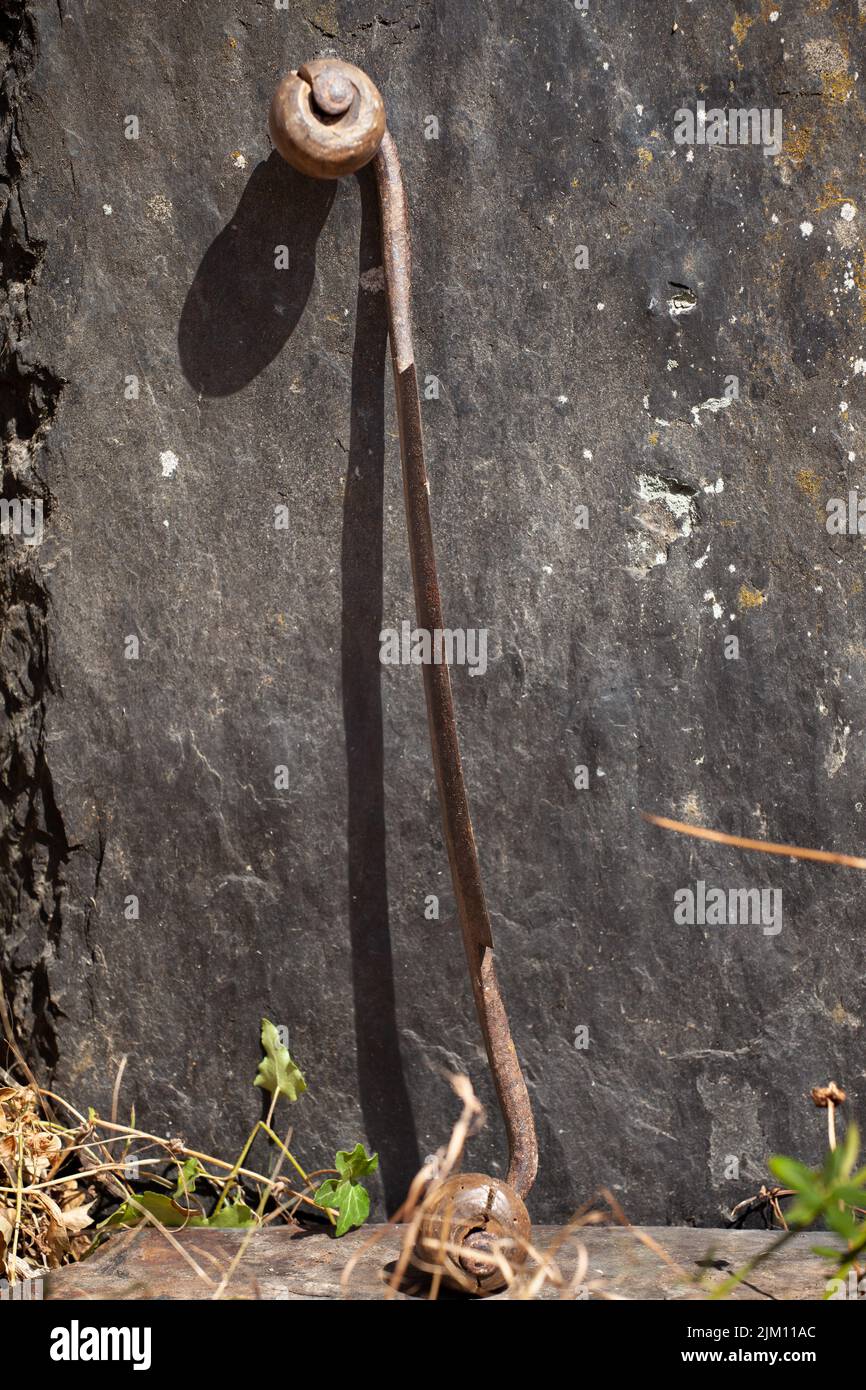 An old wheelwright's plane with two round wooden handles leaning ...