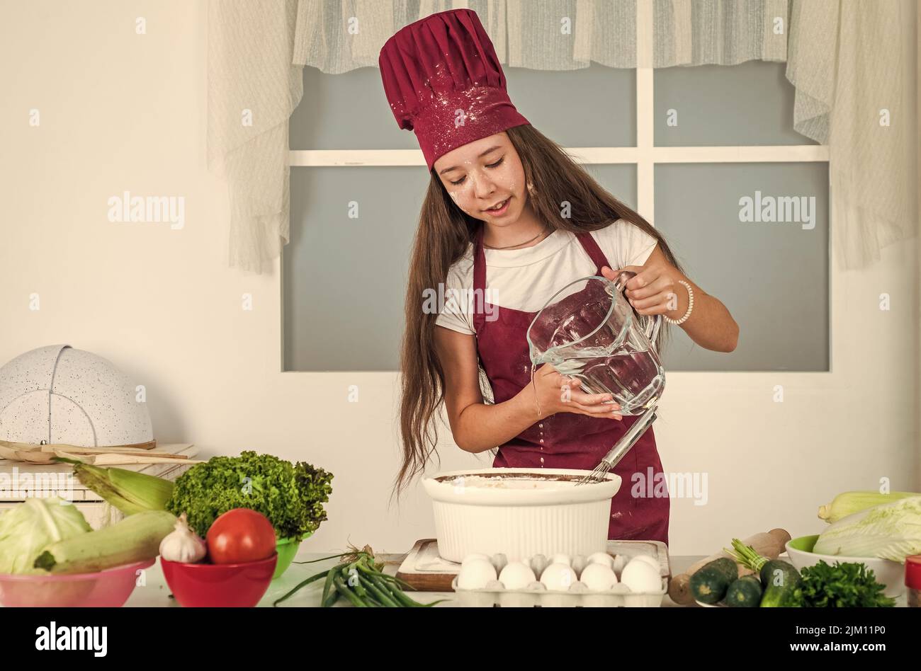 small girl baking in kitchen. kid chef cooking making dough. child ...