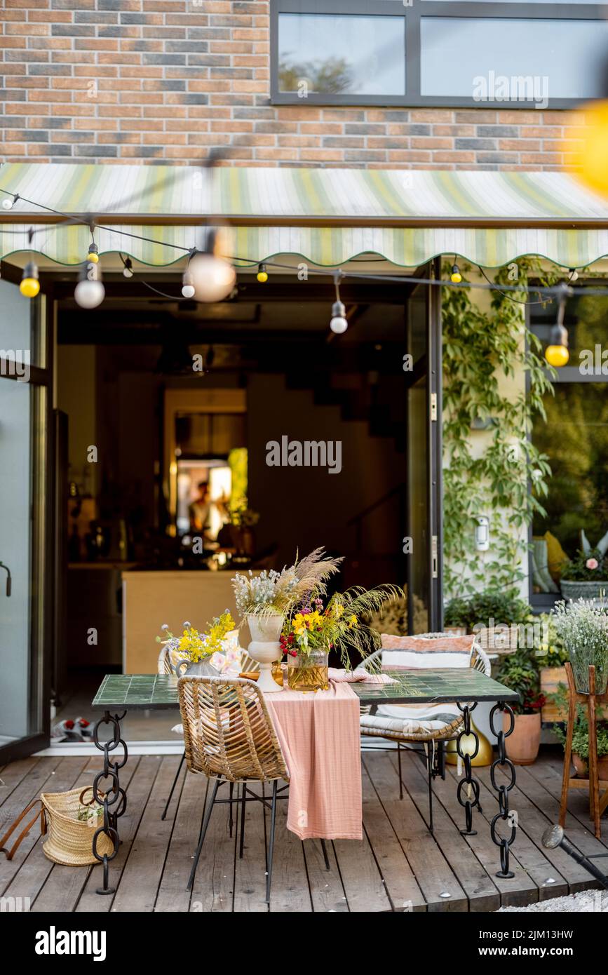 Dining place on terrace at backyard Stock Photo - Alamy