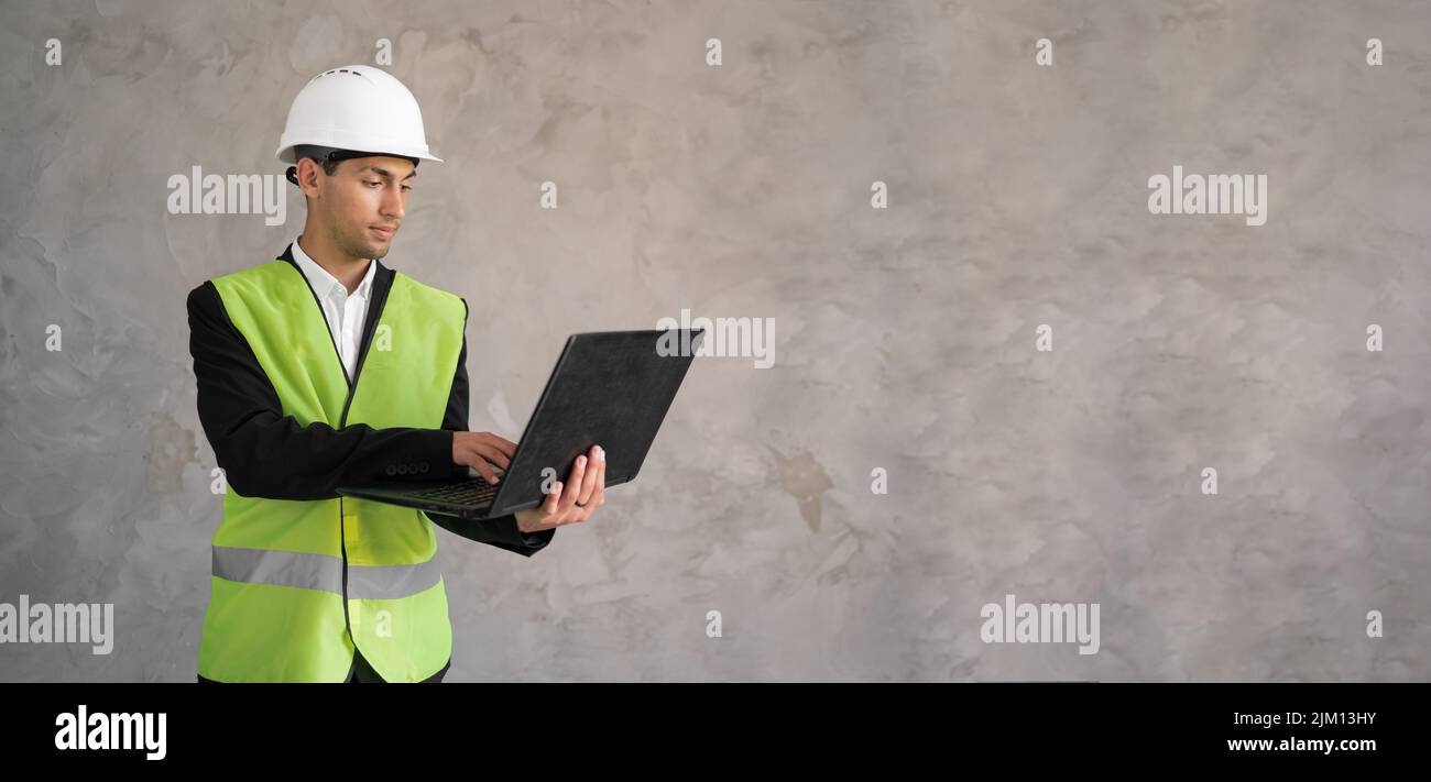 Muslim civil engineer using laptop. Engineering and construction ...