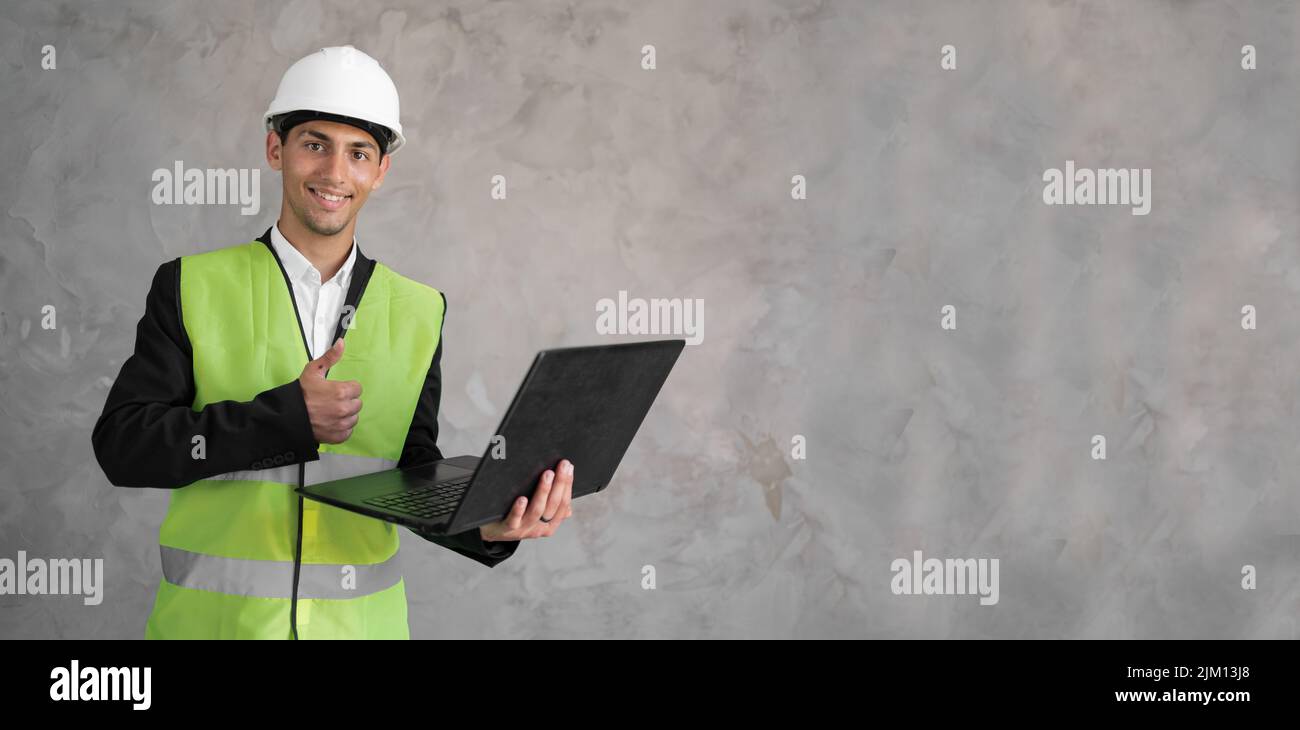 Arabic civil engineer using laptop. Engineering and construction ...