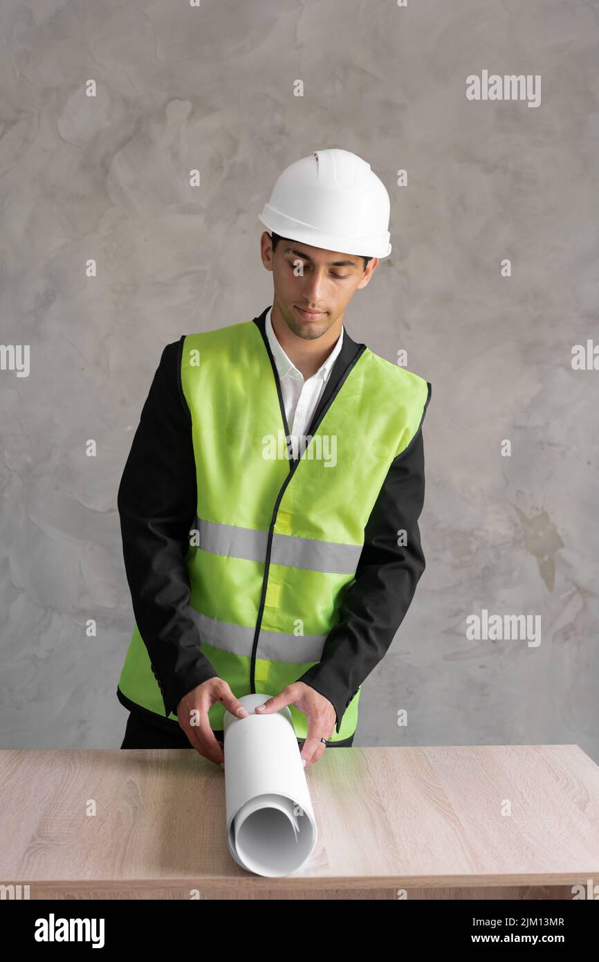Male arabic engineer with drawing on the table, work architector with ...