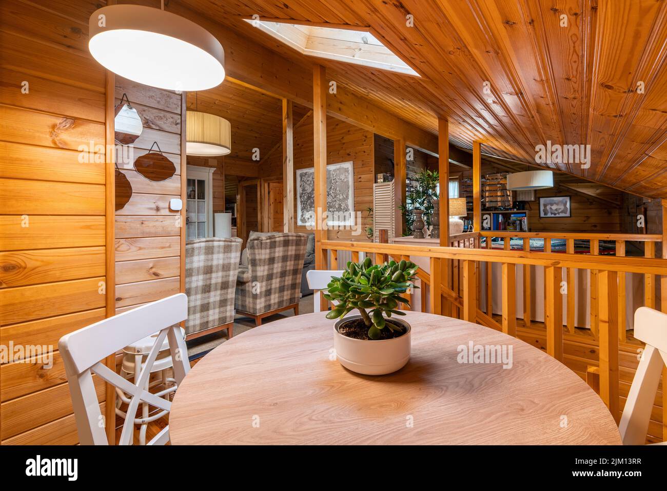 Dining room in a cozy wooden house. Rural style room with table, chairs ...