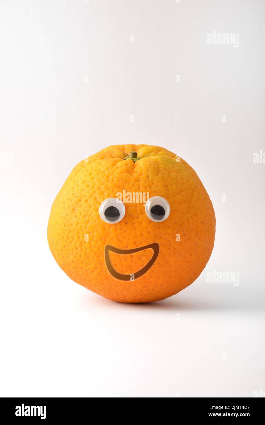 Healthy orange with face on white isolated background. Fruits and ...
