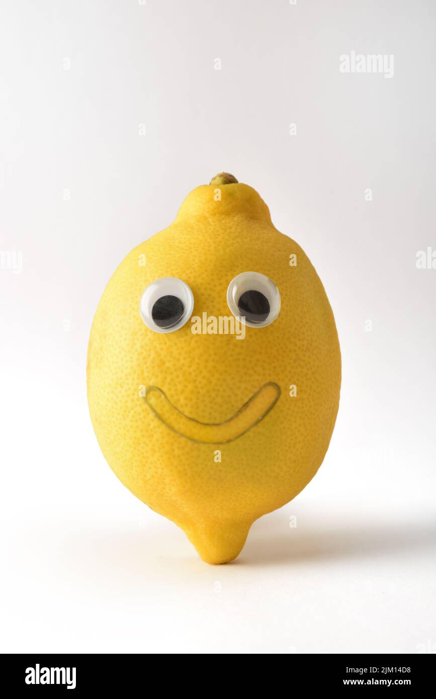 Funny lemon with face on white isolated background. Fruits and ...