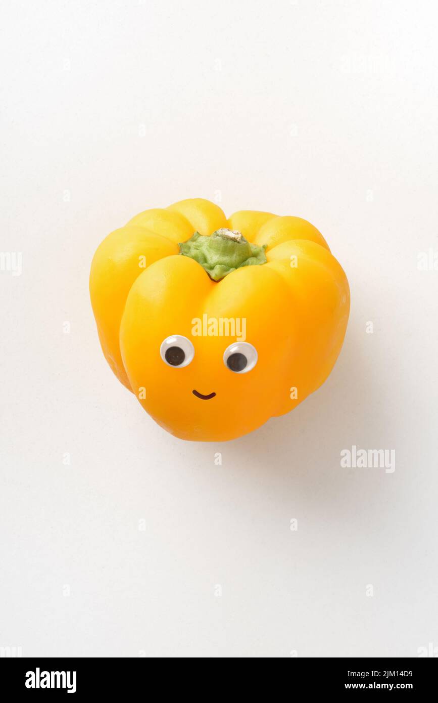 Fresh yellow pepper with face on white isolated background. Fruits and ...
