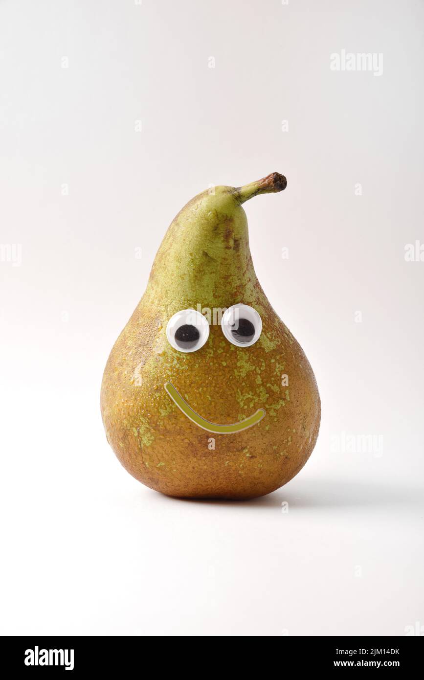 Healthy pear with face on white isolated background. Fruits and ...