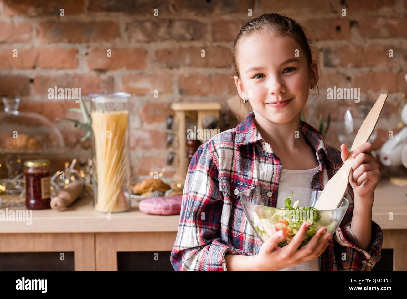 child cooking skills girl prepared salad dinner Stock Photo - Alamy
