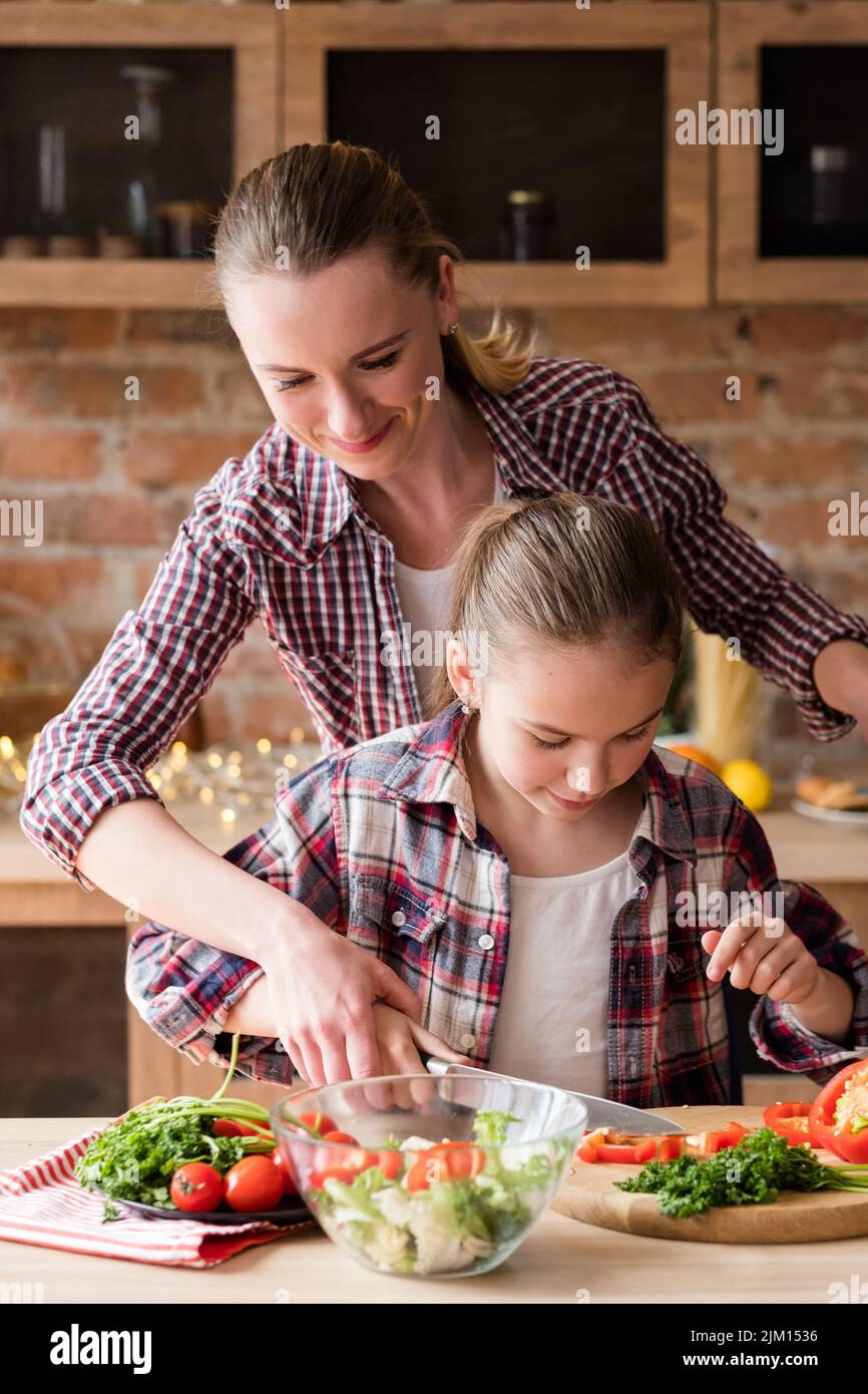 child cooking skills mom help culinary education Stock Photo - Alamy