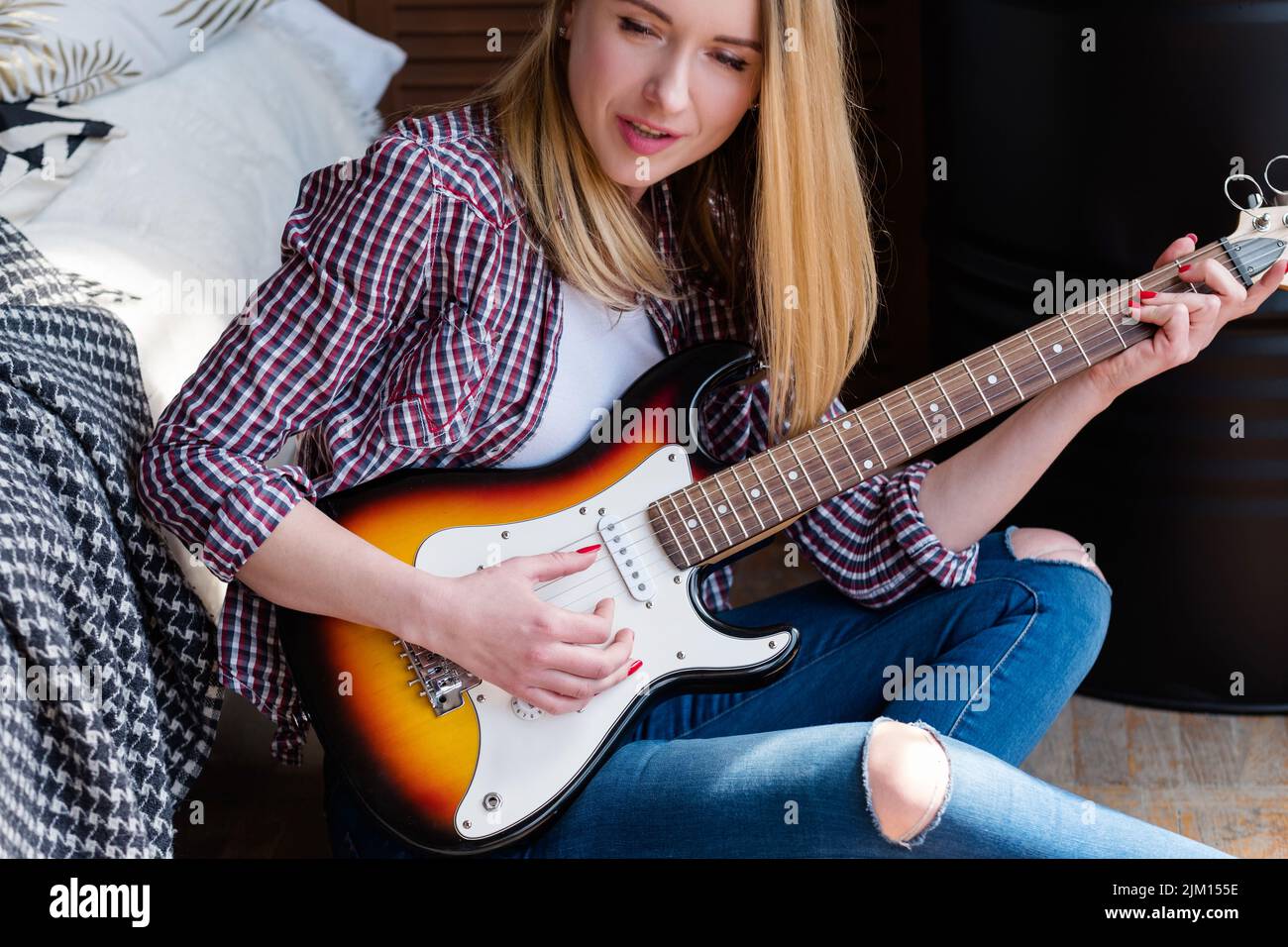 musical talent hobby woman playing guitar singing Stock Photo - Alamy