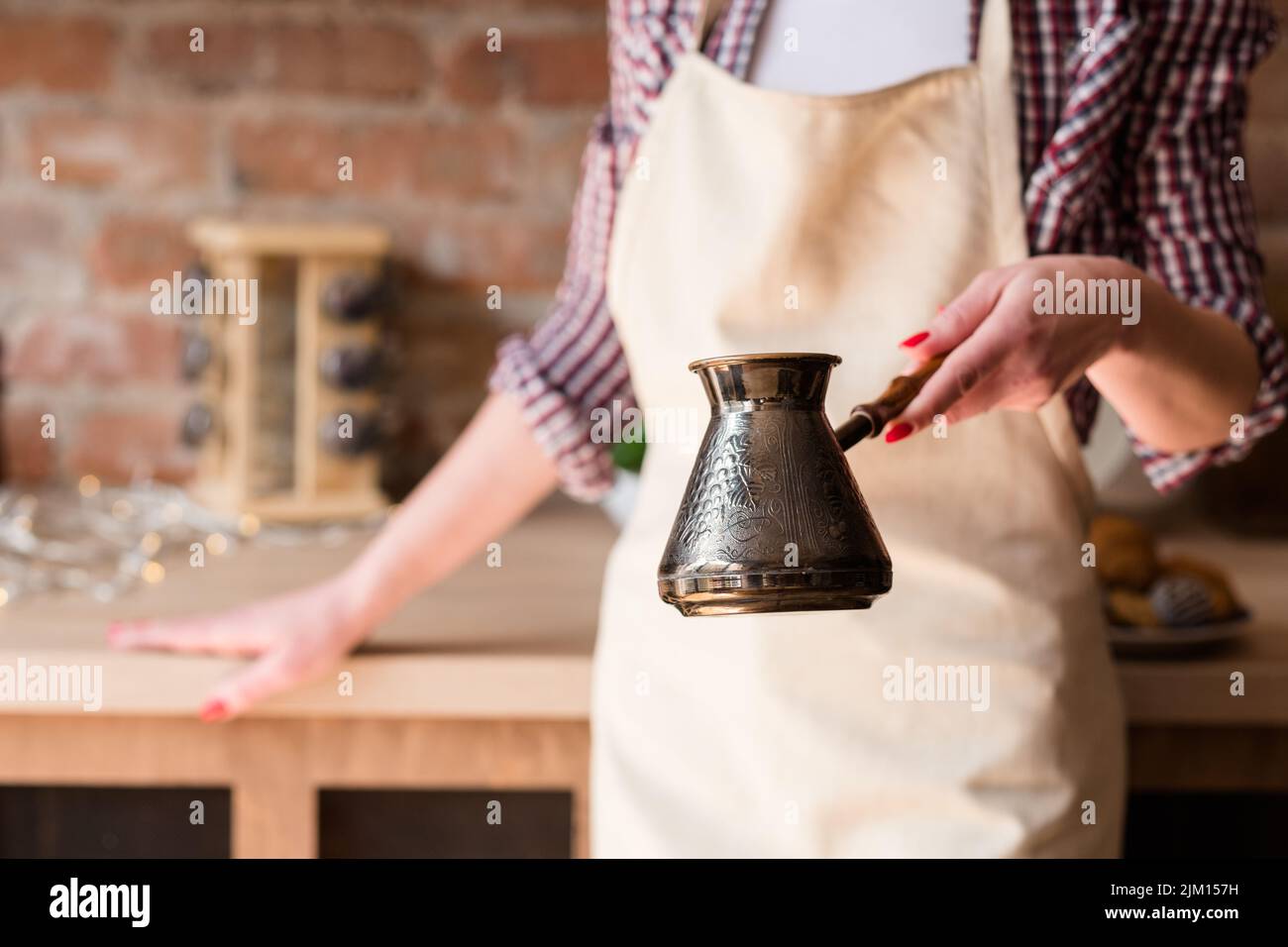 coffee brewing home holding jezve turkish pot Stock Photo - Alamy