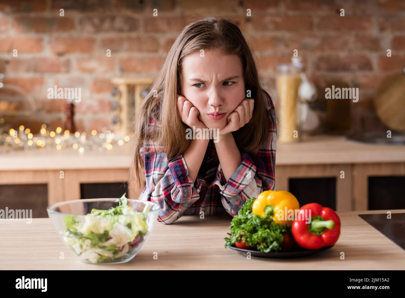 eat veggies girl displeased meal health nutrition Stock Photo - Alamy