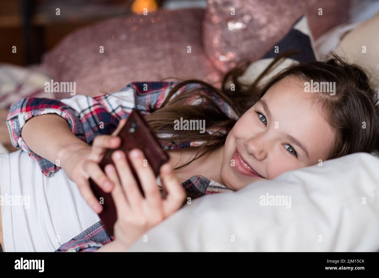 Kid using smartphone child browsing hi-res stock photography and images ...