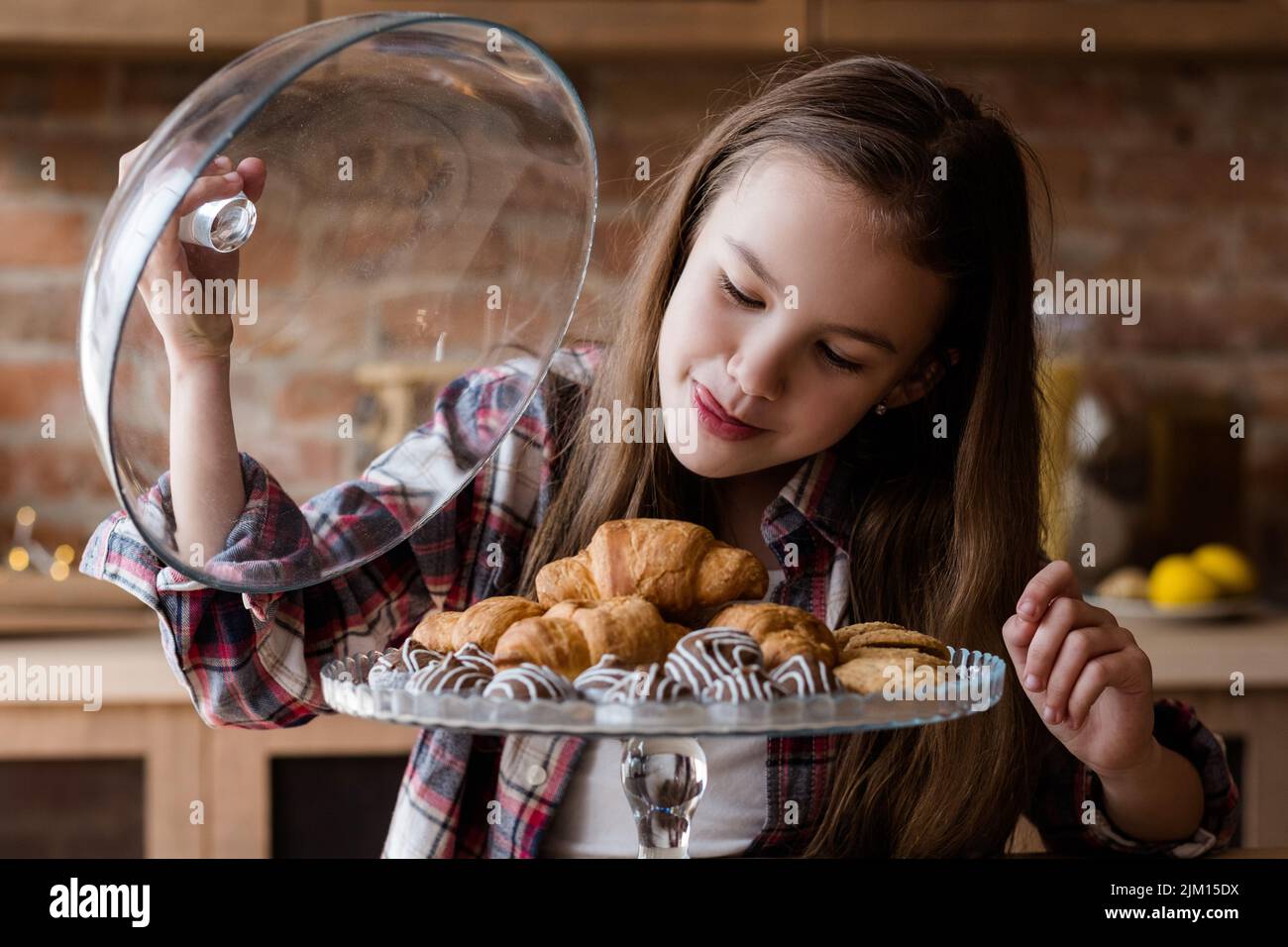 child sugar addiction croissant chocolate eating Stock Photo - Alamy