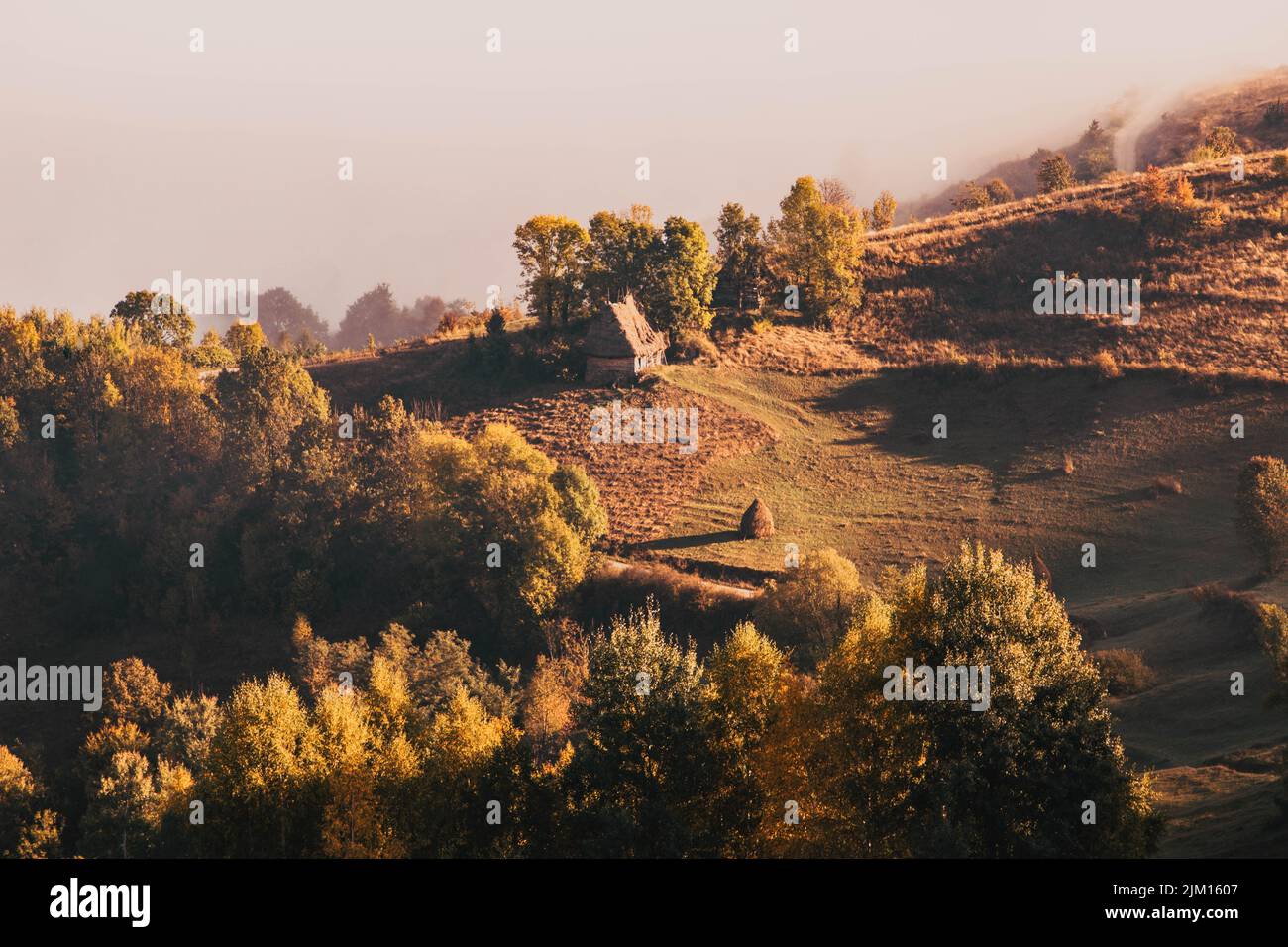 beautiful foggy autumn morning landscape in rural Transylvania Stock ...