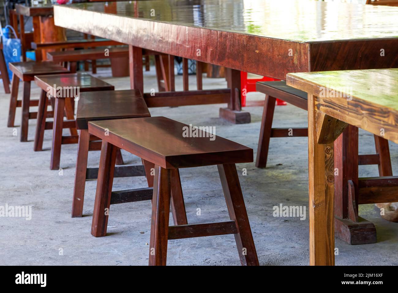 Long table and wooden benches in traditional Chinese restaurant Stock ...