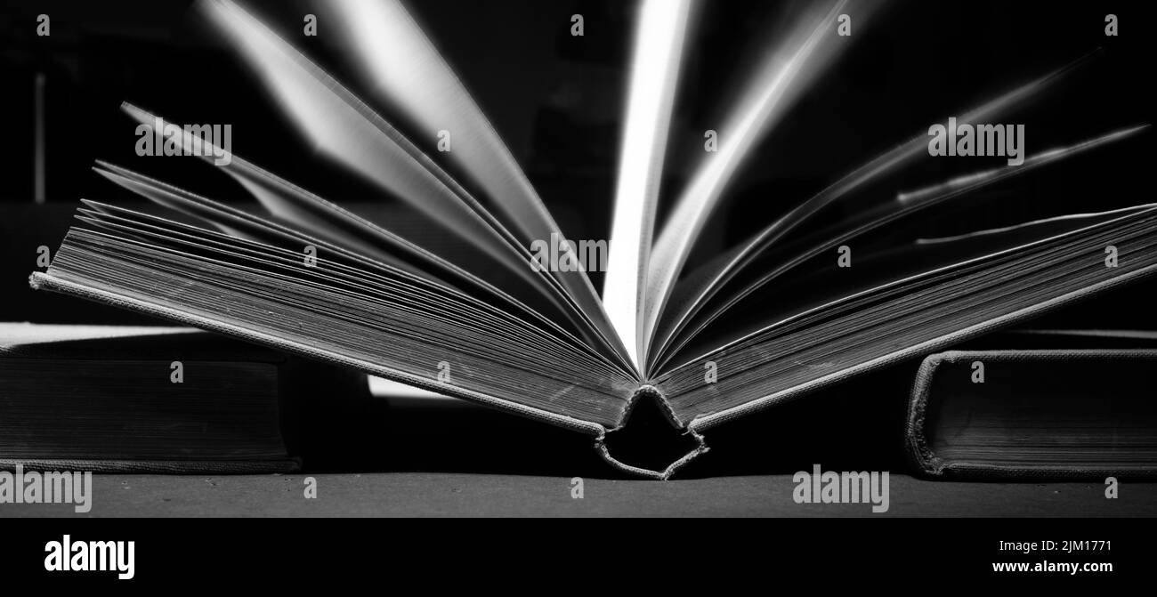 Open book close up,selective focus,black and white, home office,reading ...