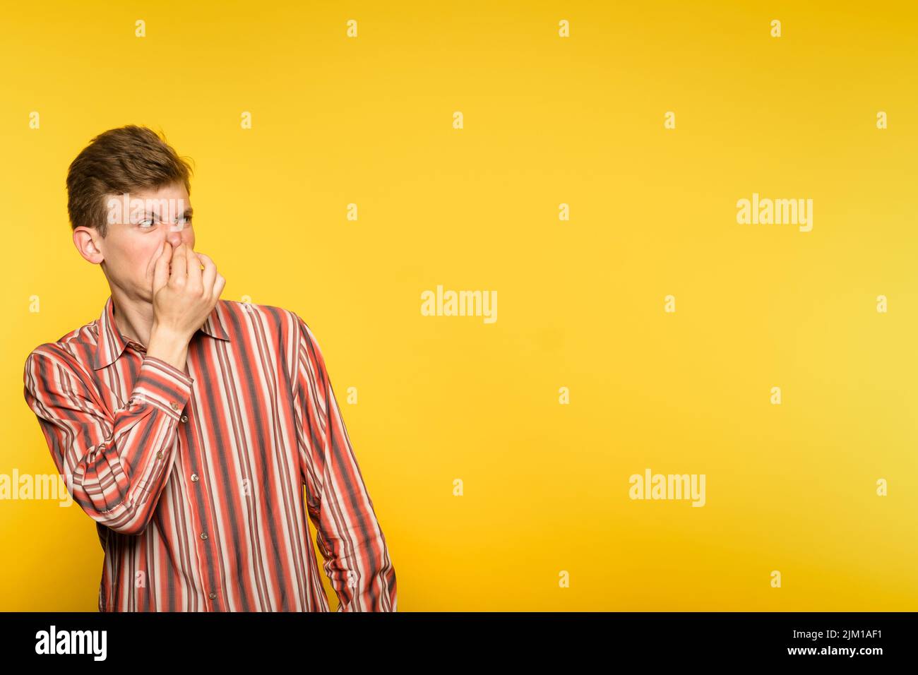 bad rancid foul smell odour man coveing nose Stock Photo - Alamy