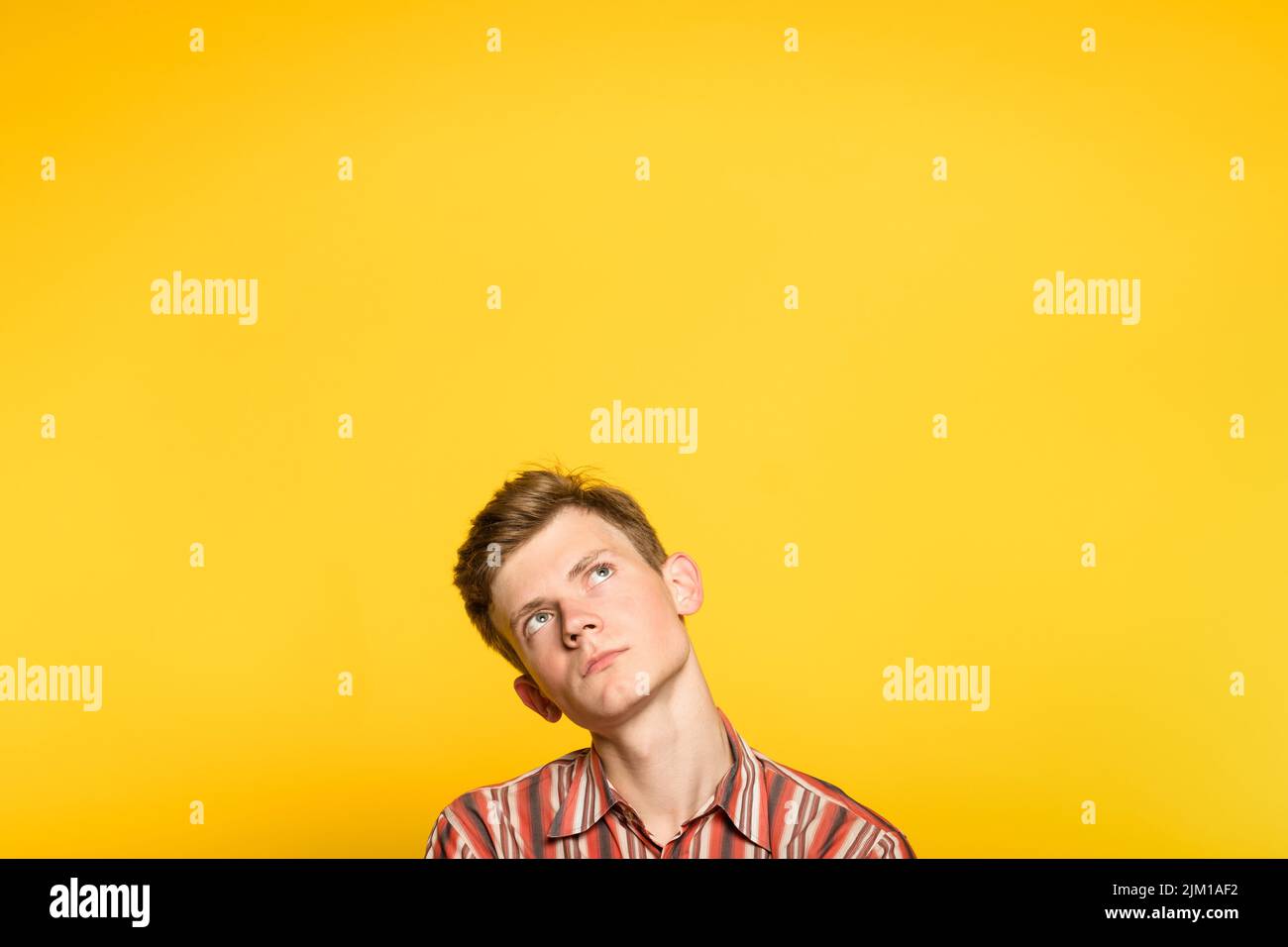 Contemplative young guy hi-res stock photography and images - Alamy