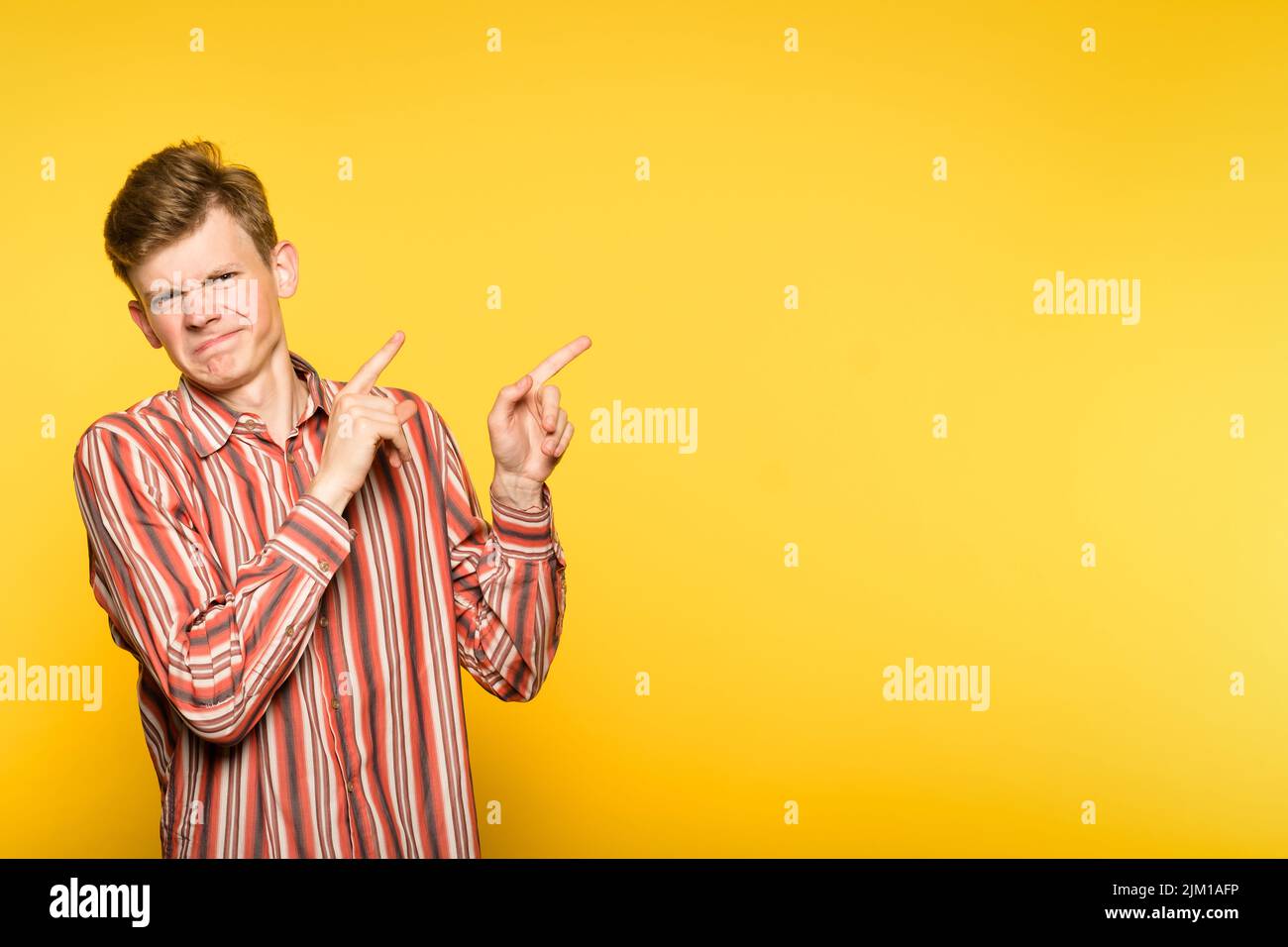 disapproving frowning critical man point sideways Stock Photo - Alamy