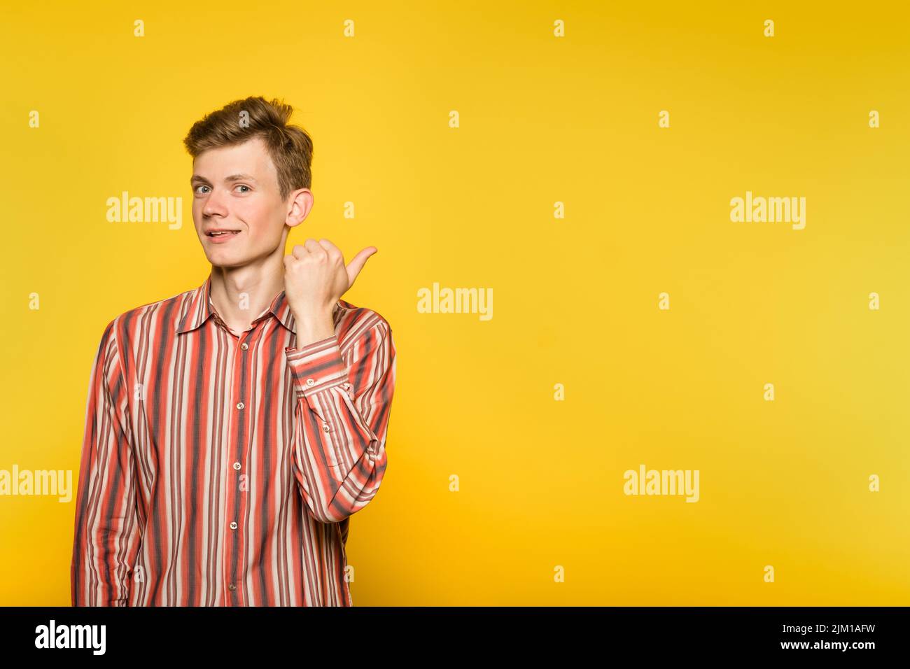 Guy pointing smiling hi-res stock photography and images - Alamy