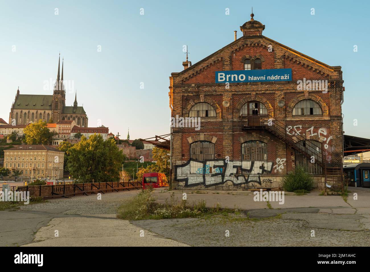 The old building of the Brno train station with a view of St. Peter and ...