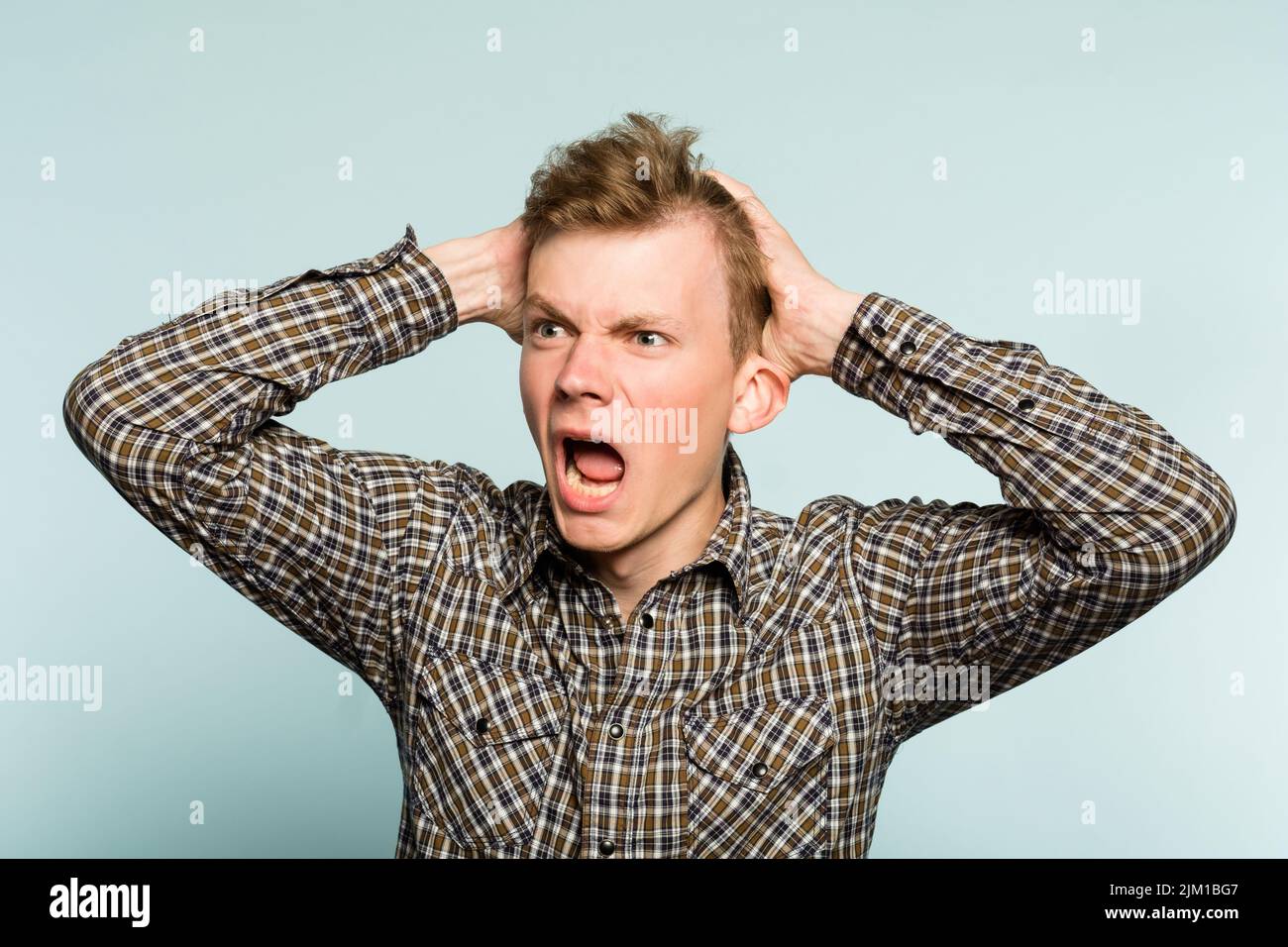 emotional breakdown desperate man distress anger Stock Photo - Alamy