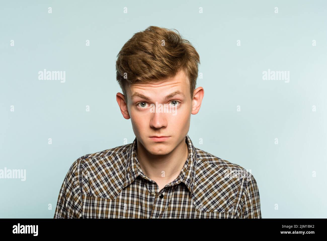 whimsical look impress man raised eyebrows emotion Stock Photo - Alamy