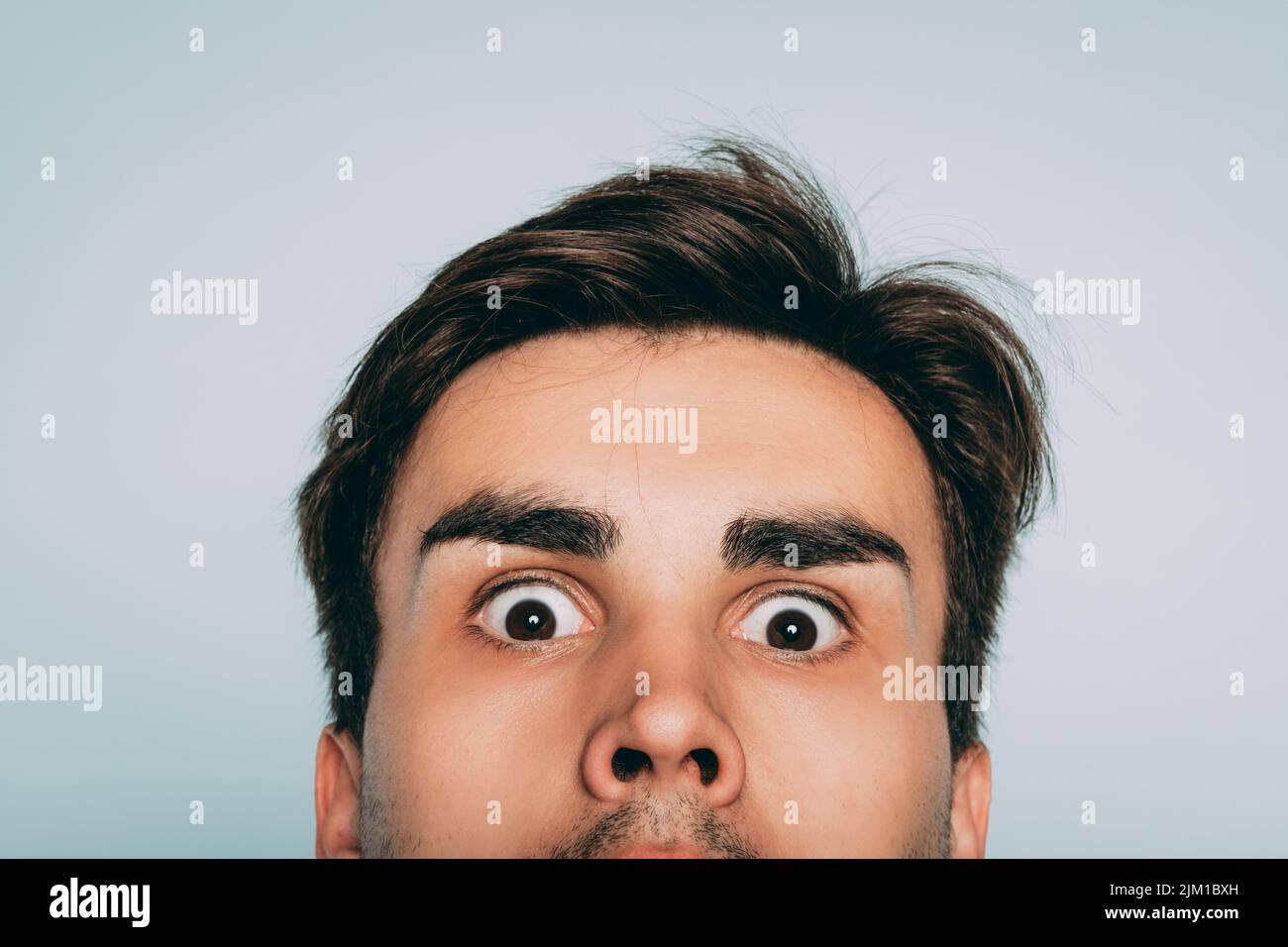 startle crazy eccentric whimsical man face peek Stock Photo - Alamy